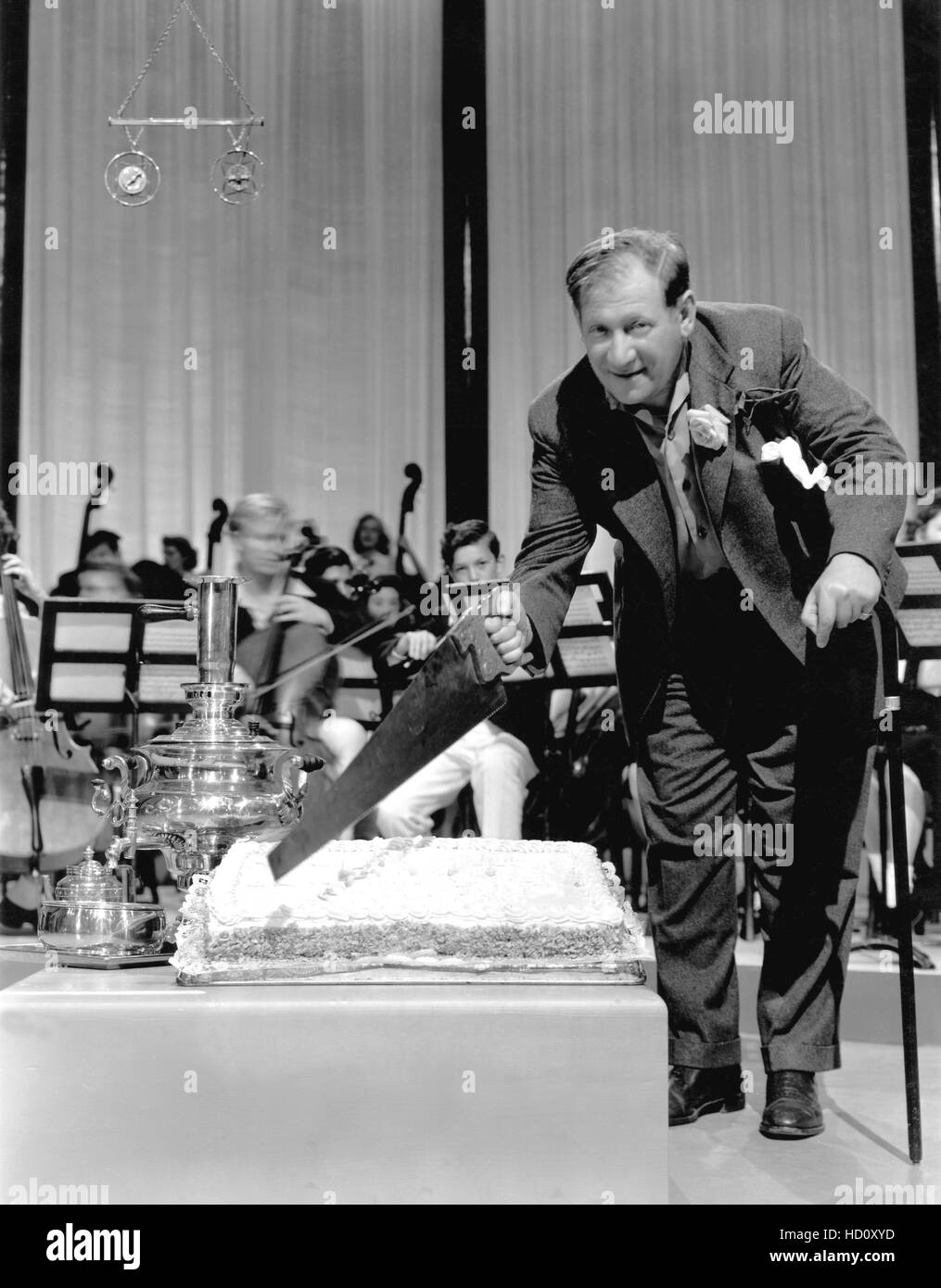 Gregory Ratoff cutting birthday cake on MGM set where he's directing ...