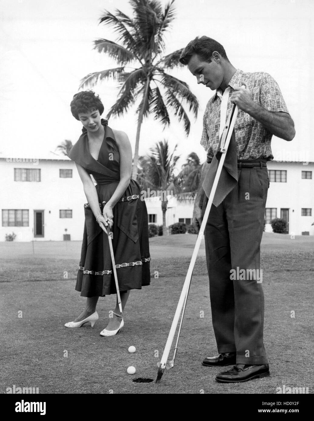 From left: Sheila Madison, Guy Madison golfing, ca. mid-late 1950s ...