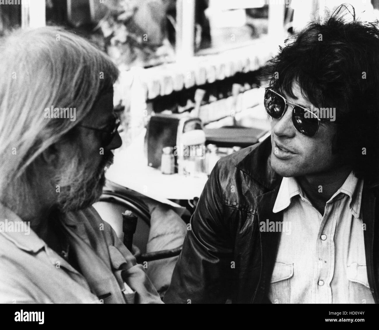 Director Hal Ashby, Warren Beatty on the set of SHAMPOO, 1975 Stock ...