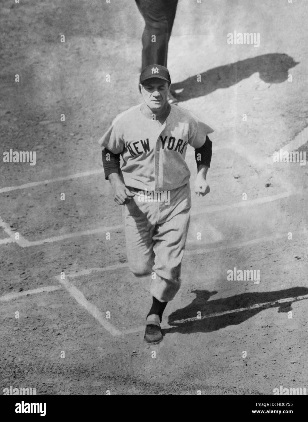 New York Yankee outfielder Hank Bauer crossing home plate after hitting ...