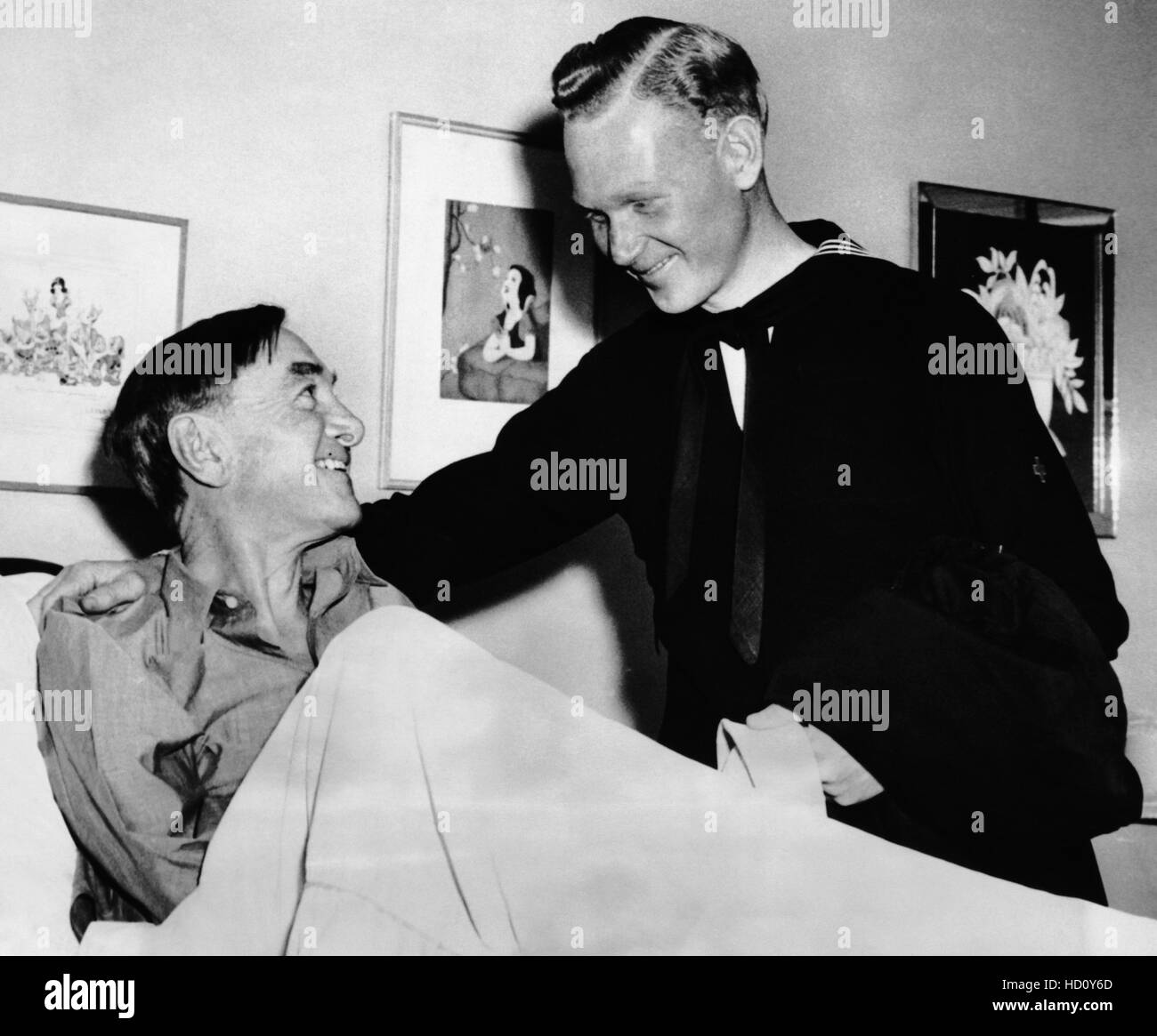 From left, Harry Carey, Sr., being visited in the hospital by Harry ...