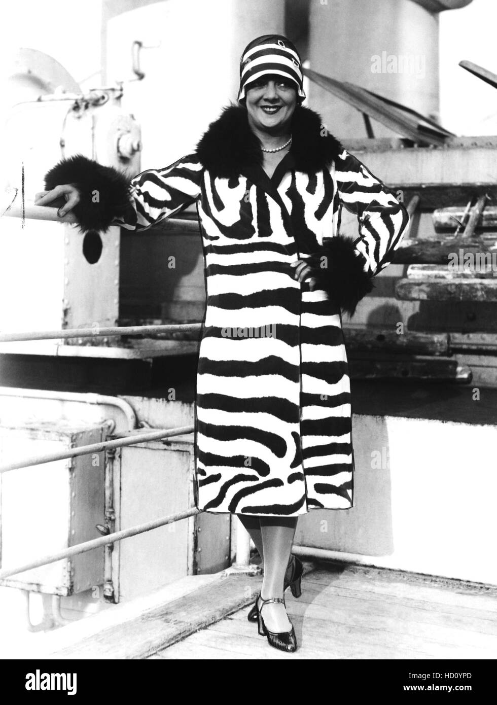 Irene Bordoni models the latest word in zebra-print ensembles, aboard ...