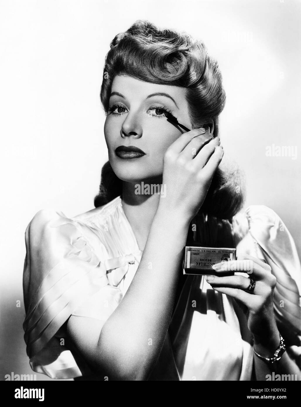 Irene Manning, showing how to apply mascara, 1943 Stock Photo - Alamy