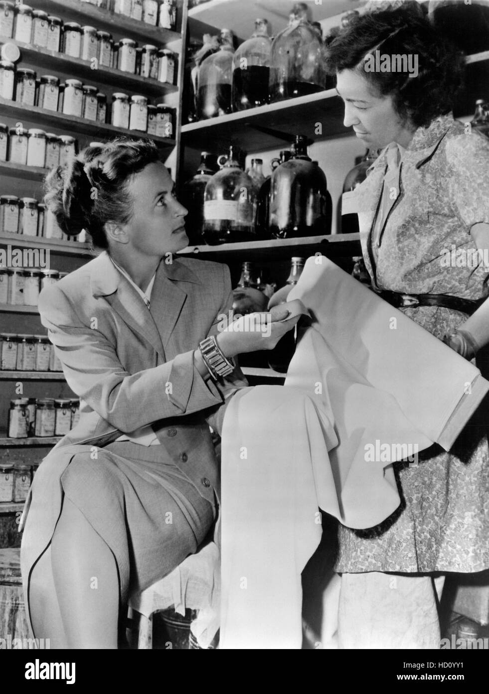 Irene Lentz designing a suit for Claudette Colbert, 1947 Stock Photo ...