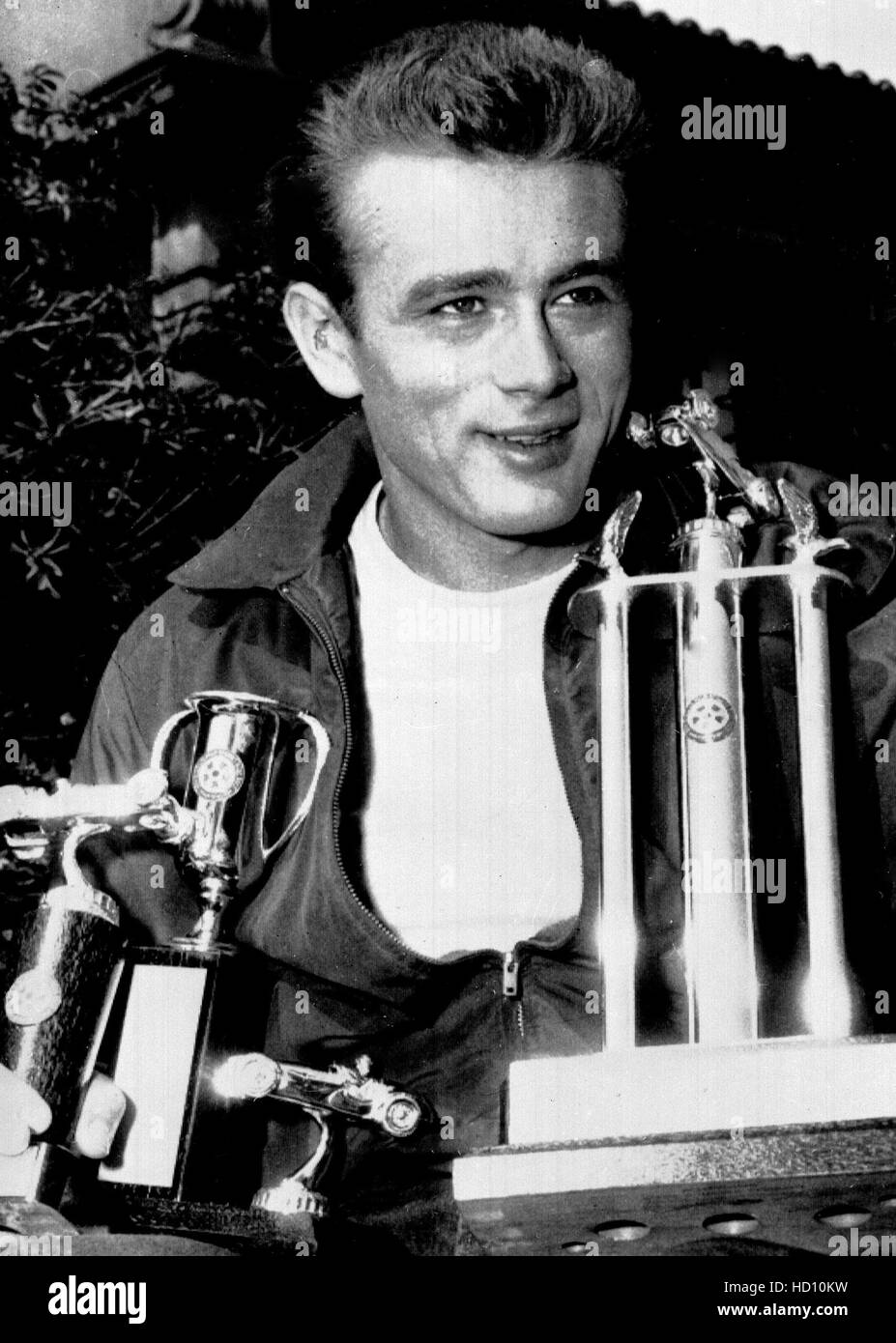 James Dean holding trophies he won in the Palm Springs road race. May ...