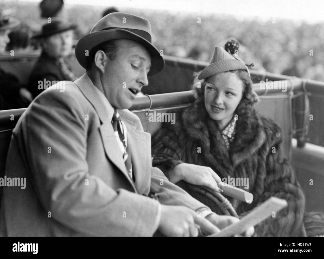 BING CROSBY and Dixie Lee at the races at Santa Anita Race Track, for the Santa Anita Handicap ...