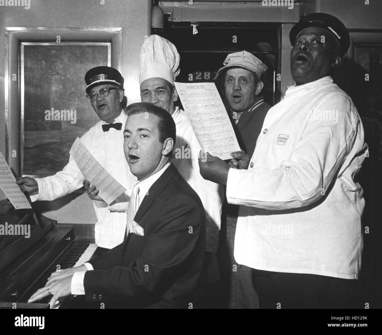 Bobby Darin, on a New York train singing with the train's conductor ...