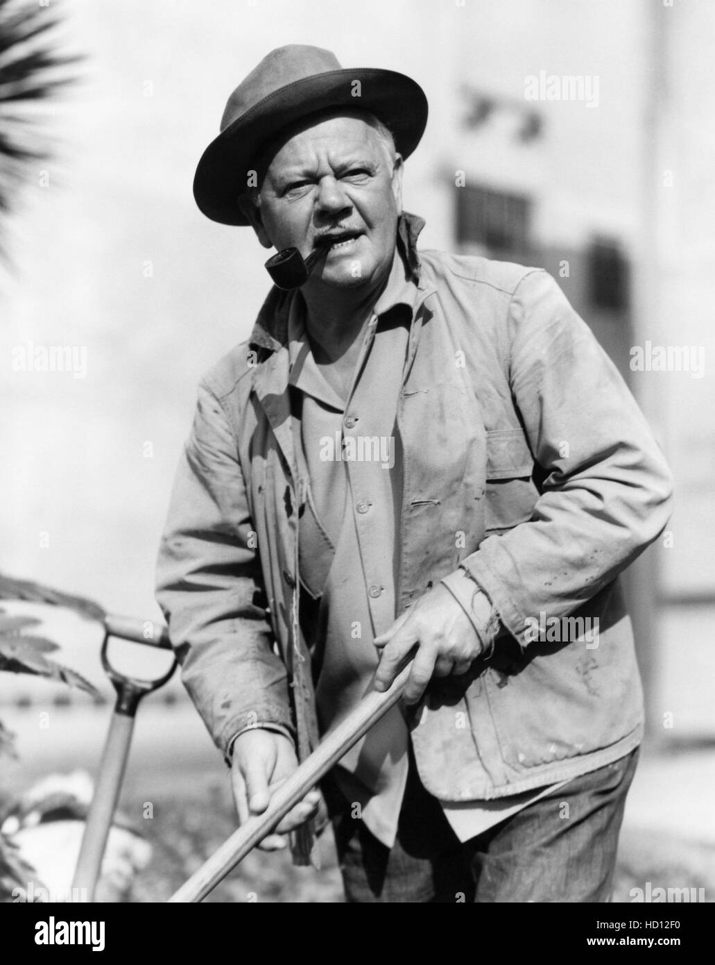 Charles Winninger gardening at home, 1943 Stock Photo - Alamy