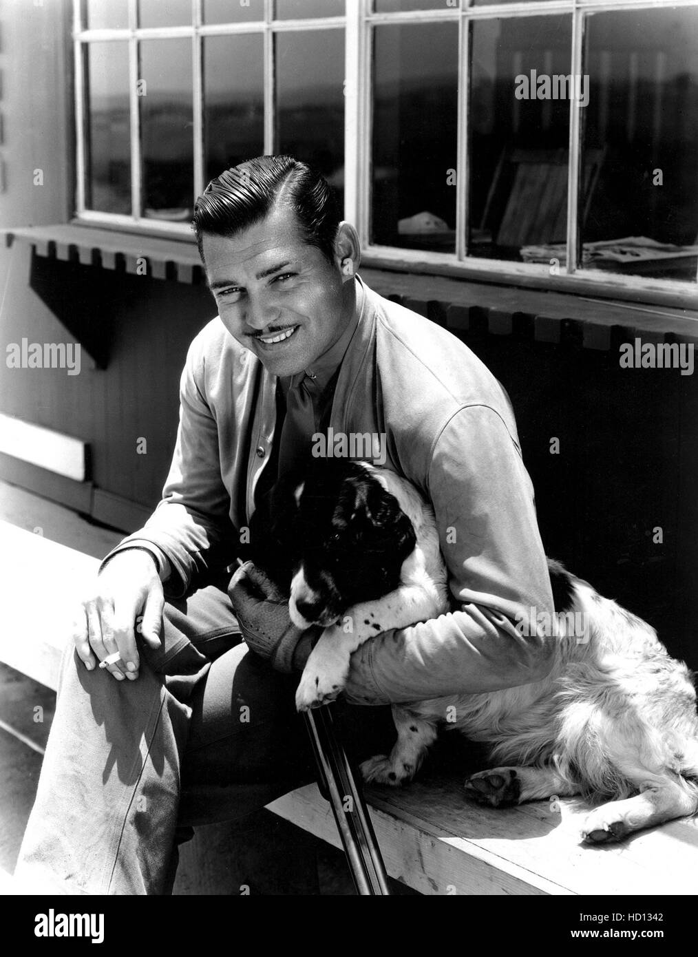 CLARK GABLE and his hunting dog BESSIE pose for a shot while skeet ...