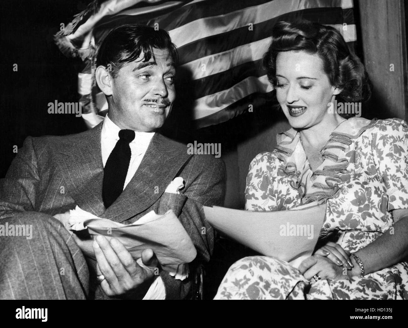CLARK GABLE and BETTE DAVIS go over the script for a COMMAND ...