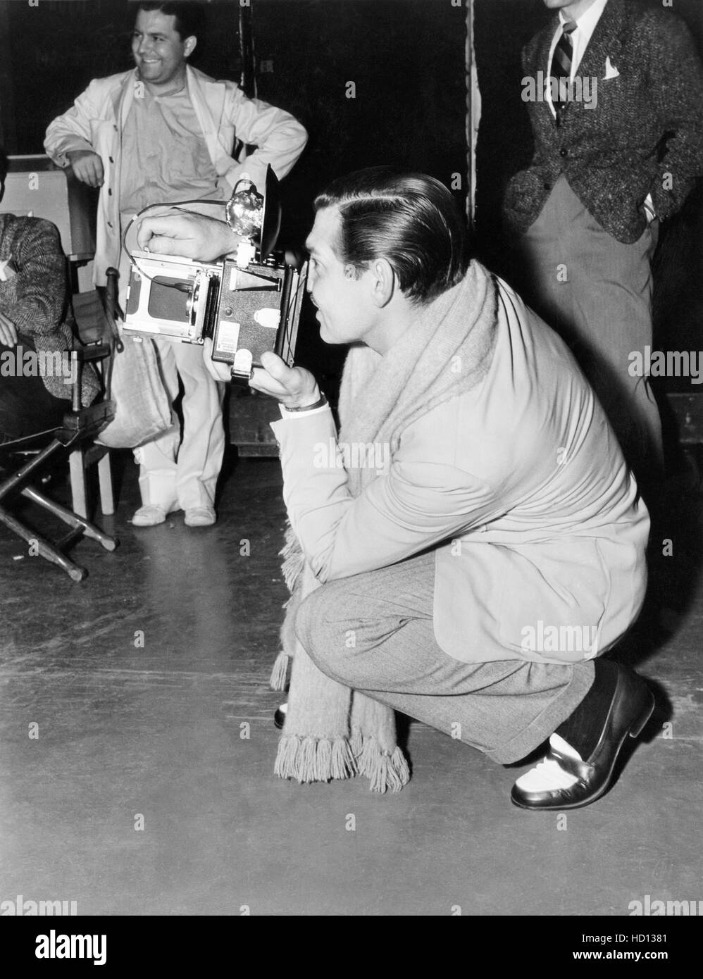 Clark Gable taking pictures on MGM set, ca. 1941 Stock Photo - Alamy