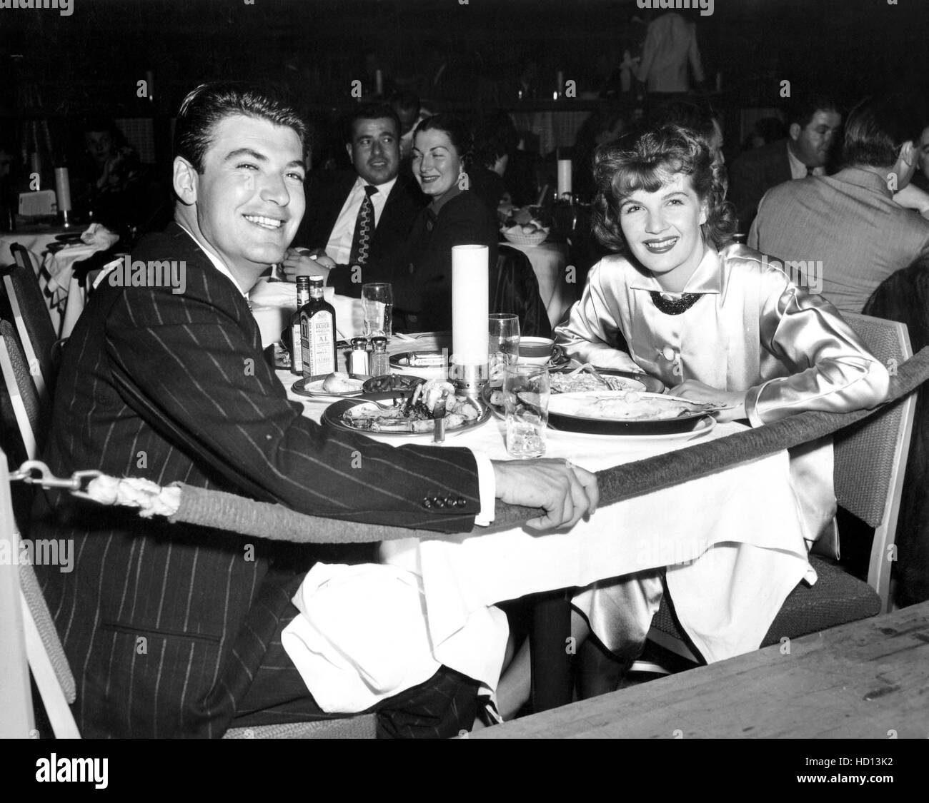From left: John Bromfield with wife Corinne Calvet taking in an evening ...