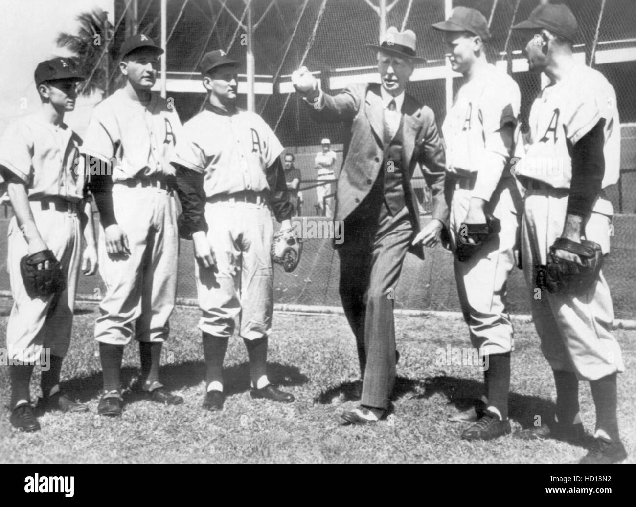 Philadelphia Athletics manager Connie Mack (in suit) teaching ...