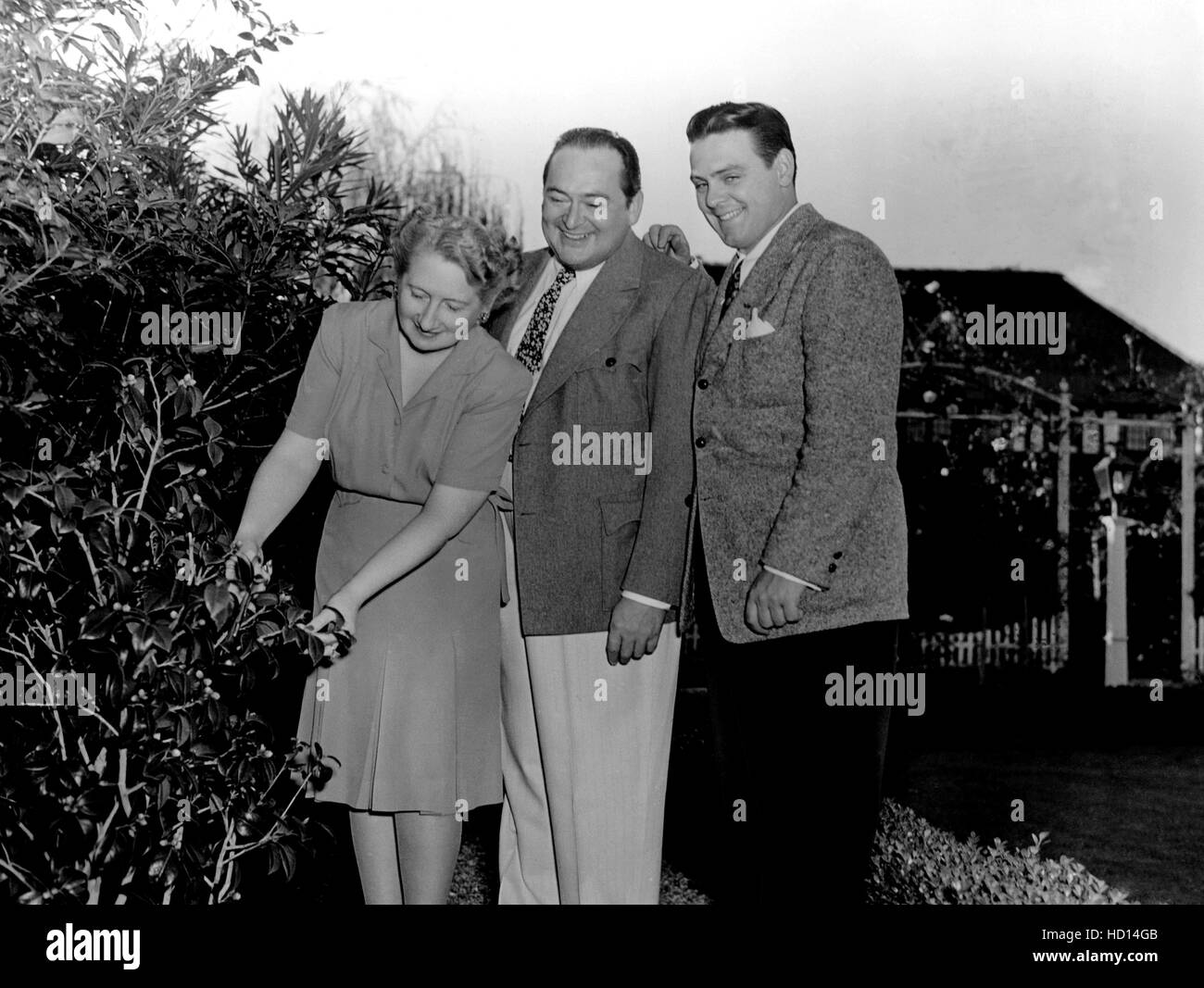 From left: Olive Arnold, Edward Arnold, Edward Arnold, Jr., in their backyard, ca. 1942 Stock ...