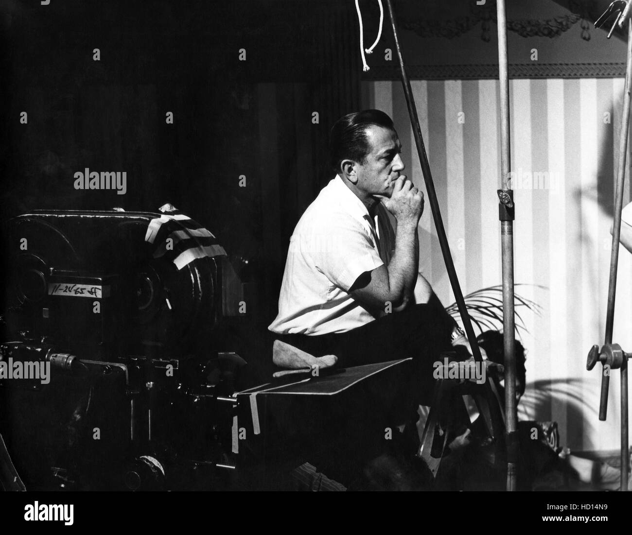Director Edward Dmytryk in a pensive moment, on set, ca. 1965 Stock Photo - Alamy