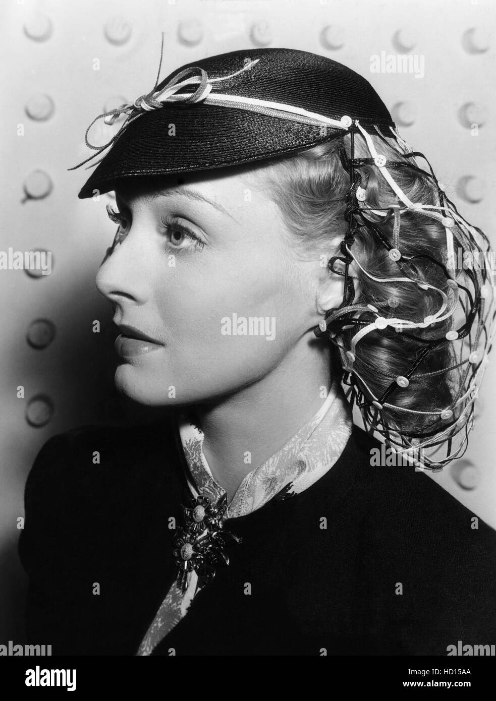 Ellen Drew, modeling a straw-braided snood for Easter, 1939 Stock Photo ...
