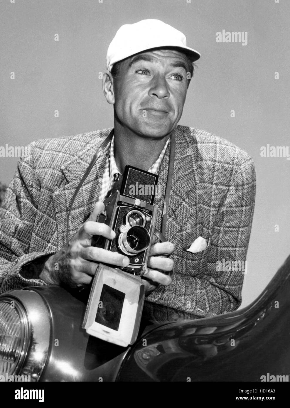 Gray Cooper, rolleiflex camera in hand, late 1940s Stock Photo - Alamy