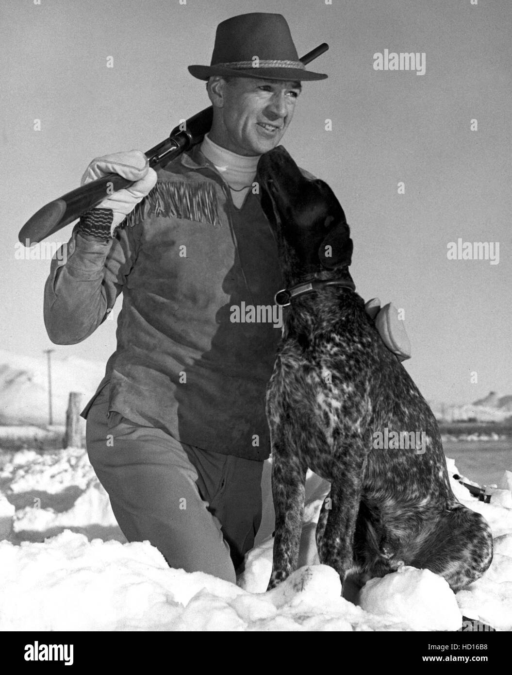 GARY COOPER and his German Pointer pal enjoy a hunting excursion in Sun ...