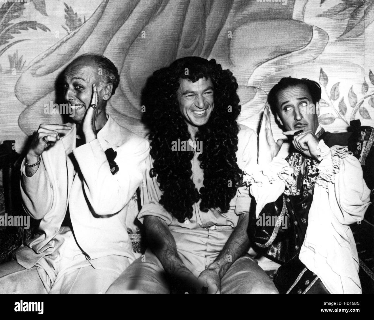 MITCHELL LEISEN, GARY COOPER and BASIL RATHBONE gag it up Stock Photo ...