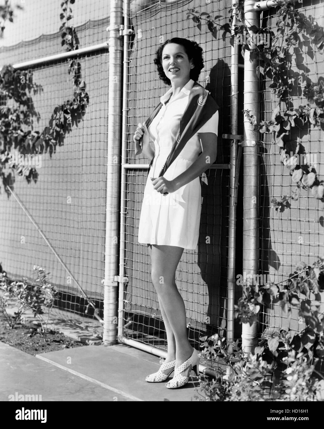 Gale Sondergaard in a white sharkskin one-piece shorts suit, 1939 Stock ...
