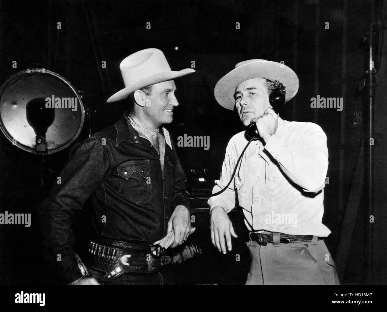 Songwriter Stan Jones (r) signs over the screen rights for the song ...