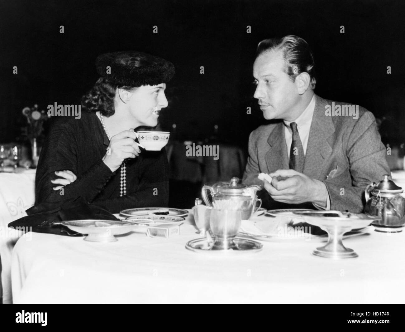 Melvyn Douglas, right, and his wife, Helen Gahagan Douglas, having tea ...