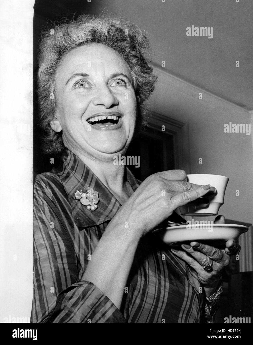Hermione Gingold observing British tradition of afternoon tea, 1954 ...