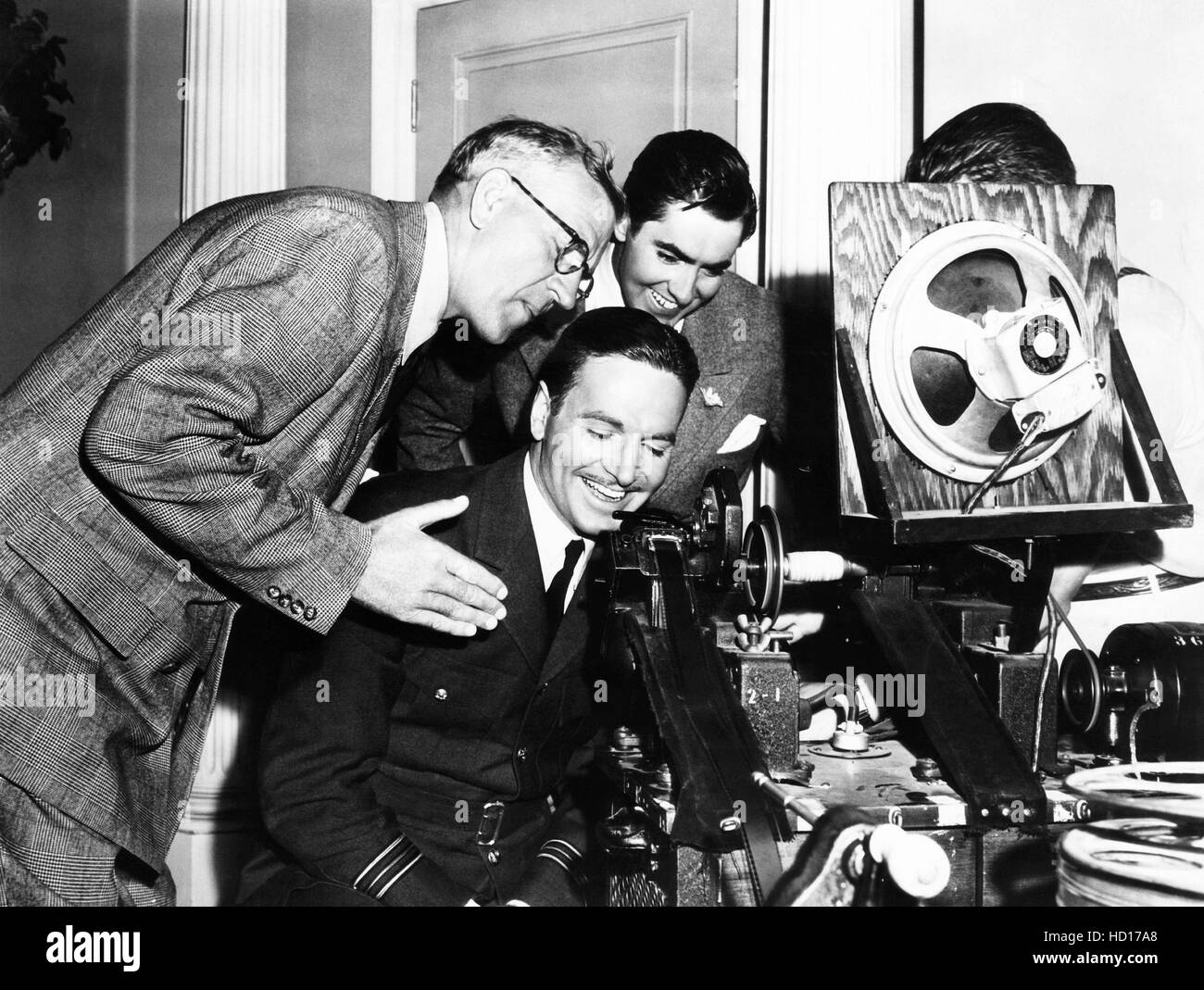 From left: director Henry King, John Sutton (seated), Tyrone Power ...