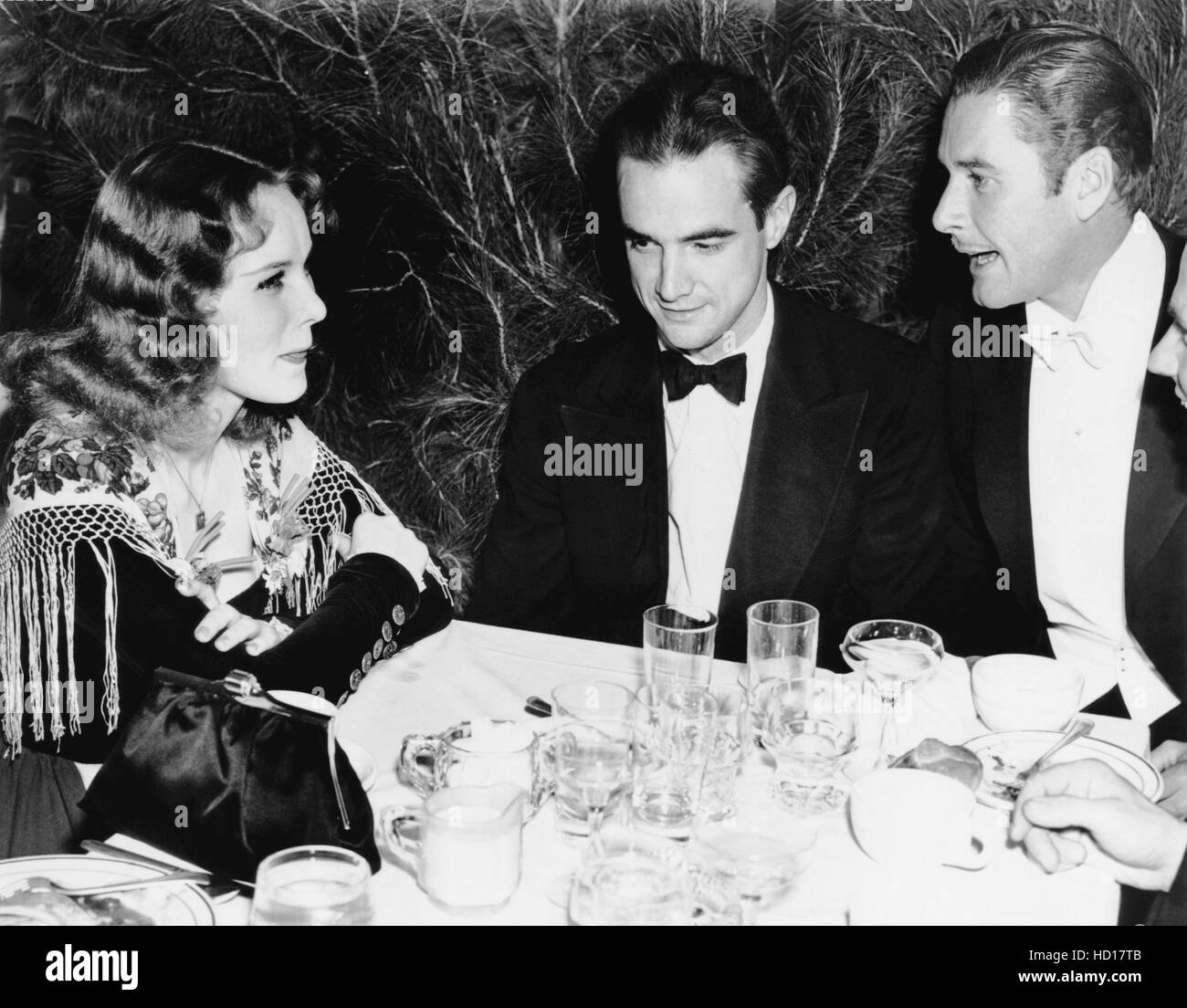 From left, Helen Gilbert, Howard Hughes, Errol Flynn, out on the town ...