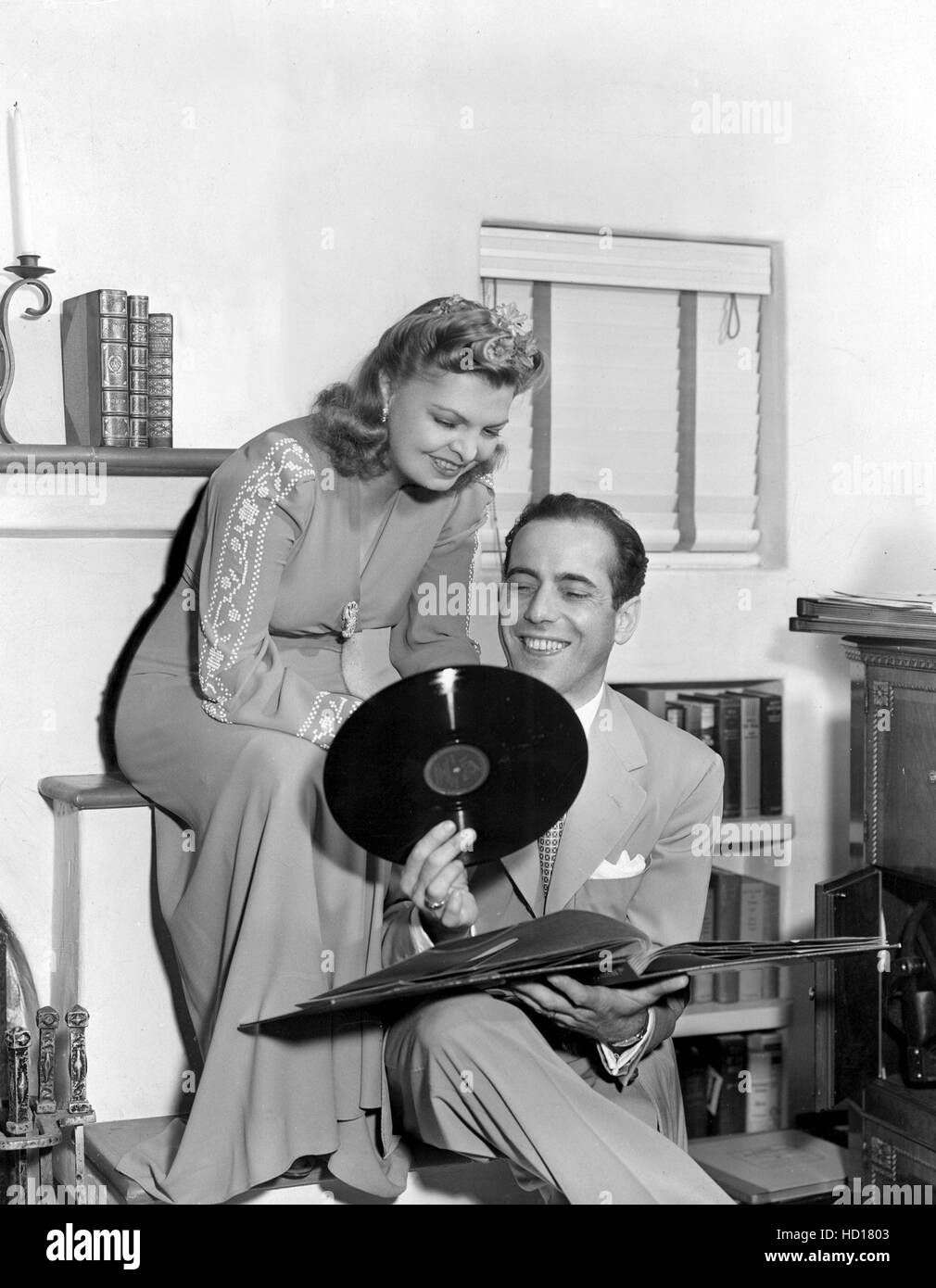 MAYO METHOT and husband HUMPHREY BOGART examine a new addition to their ...