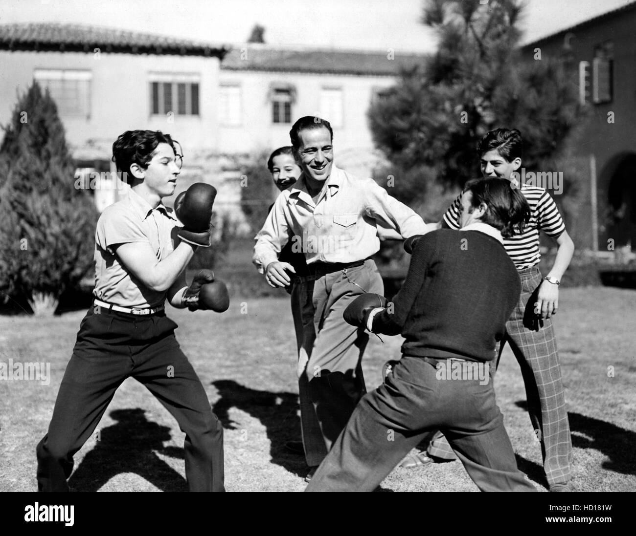 Humphrey Bogart, with Gabriel Dell (l.), Leo Gorcey, Bobby Jordan, and ...