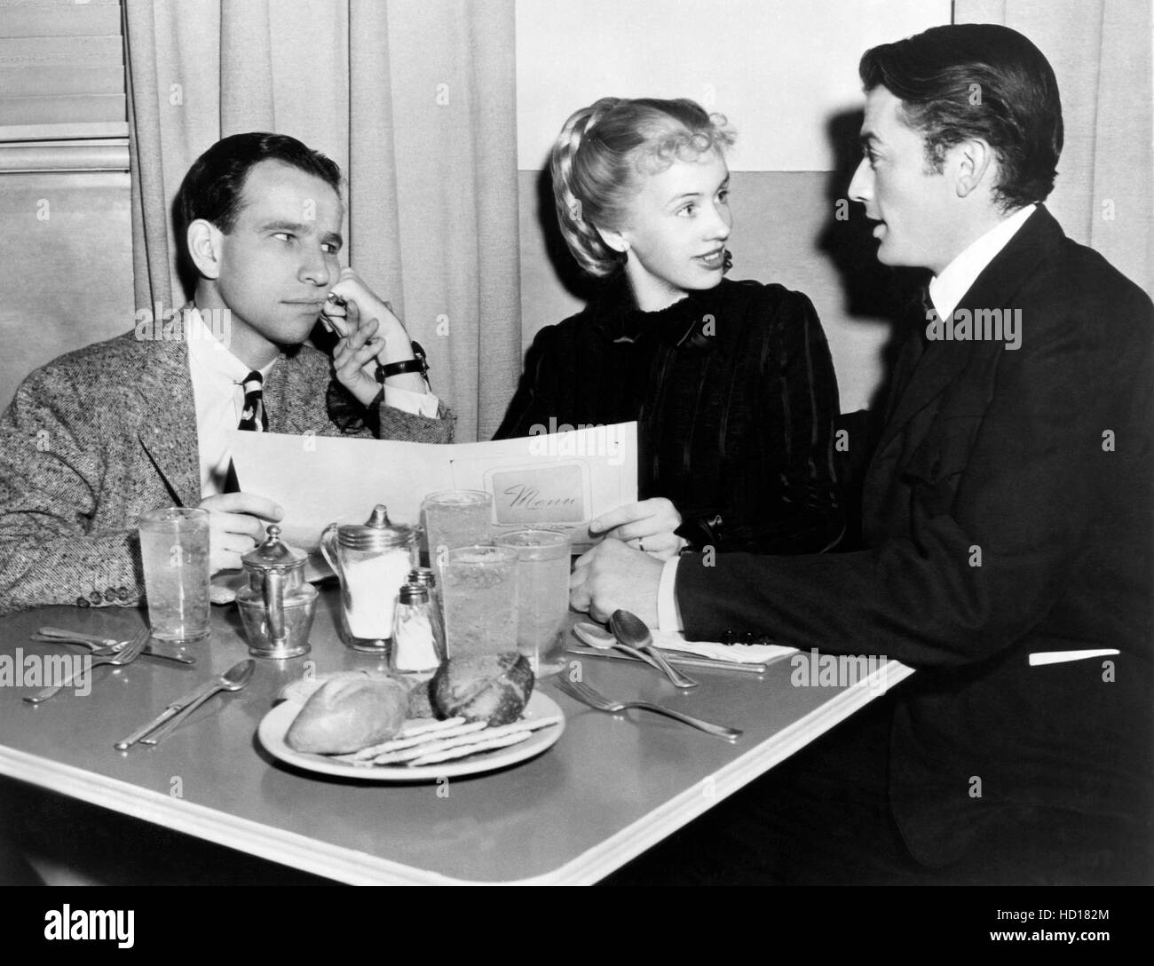 Hume Cronyn, Jessica Tandy, Gregory Peck, ordering lunch, 1946 Stock ...
