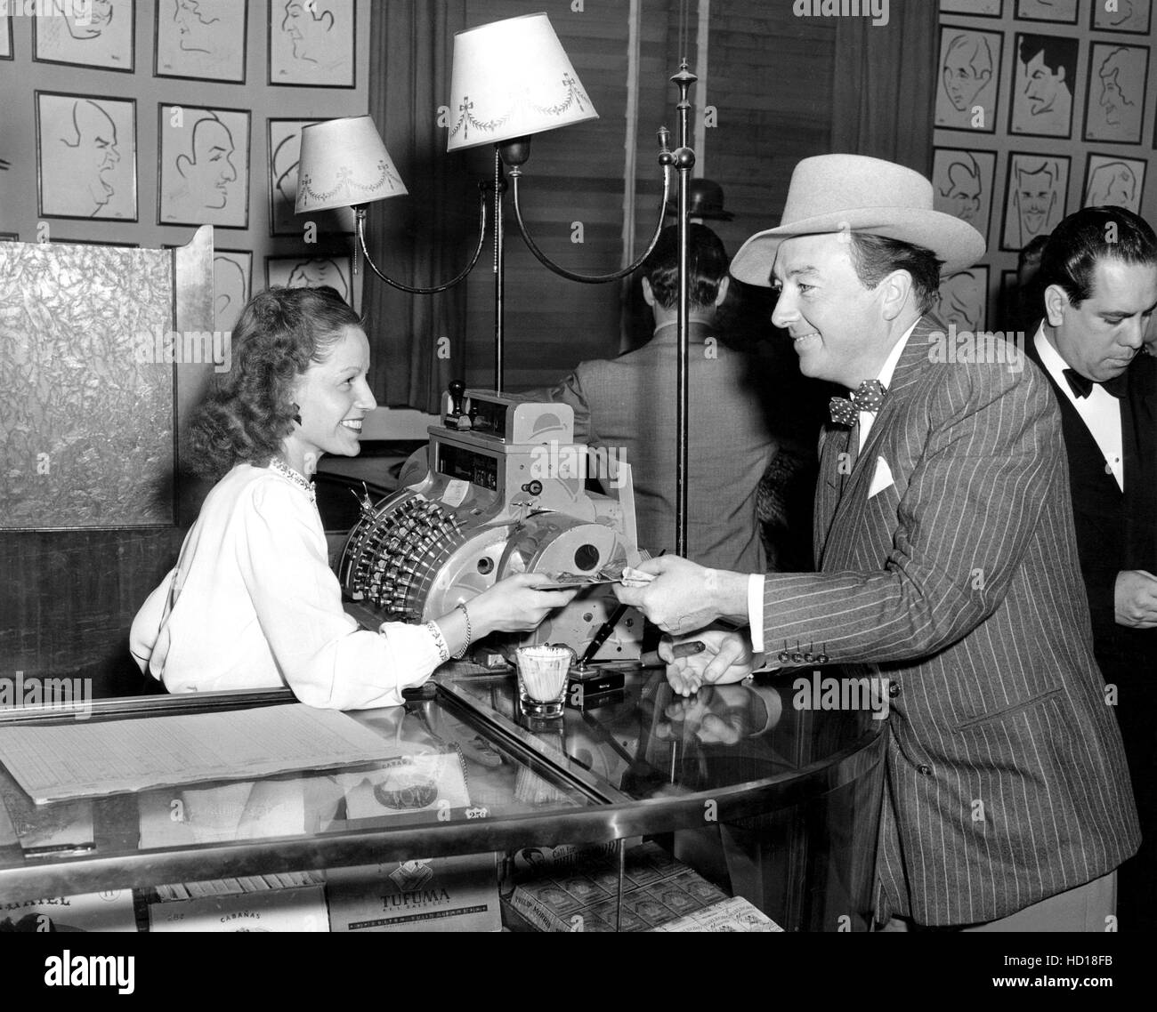 Jack Haley (right) paying cashier at the Brown Derby, ca. 1945 Stock ...