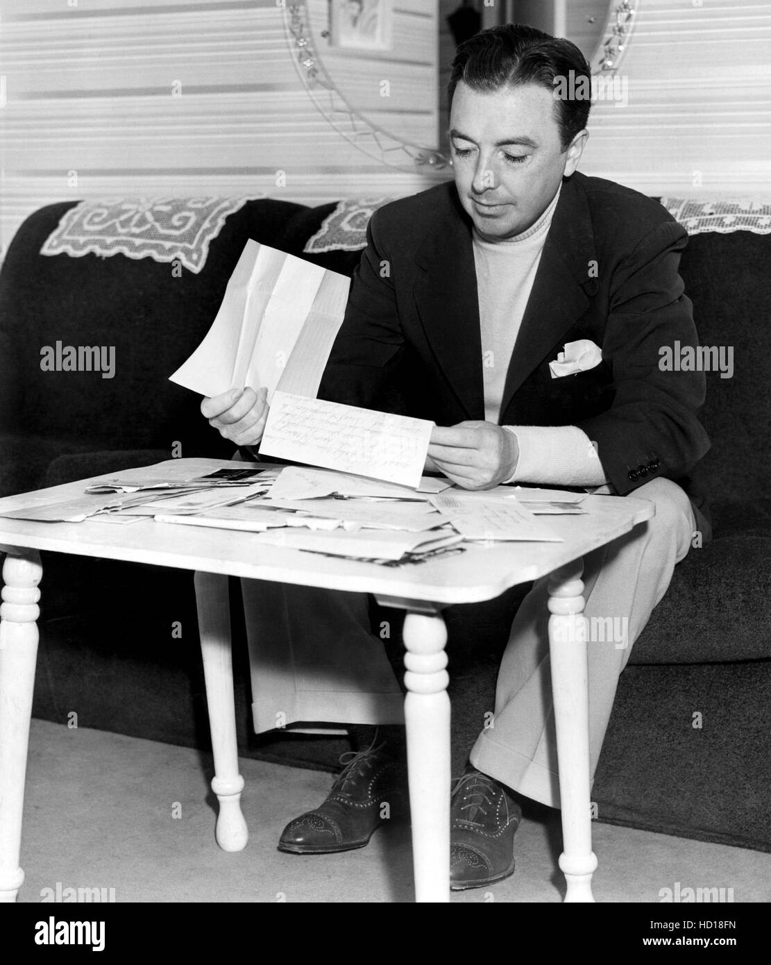 Jack Haley reading fan mail at home, ca. 1938 Stock Photo - Alamy