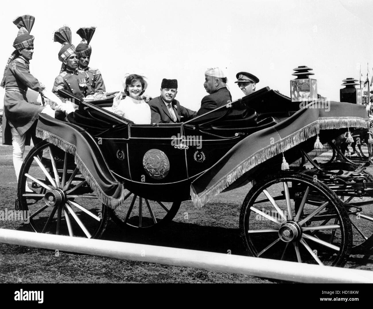 From left, in carriage, First Lady Jacqueline Kennedy, Pakistan ...