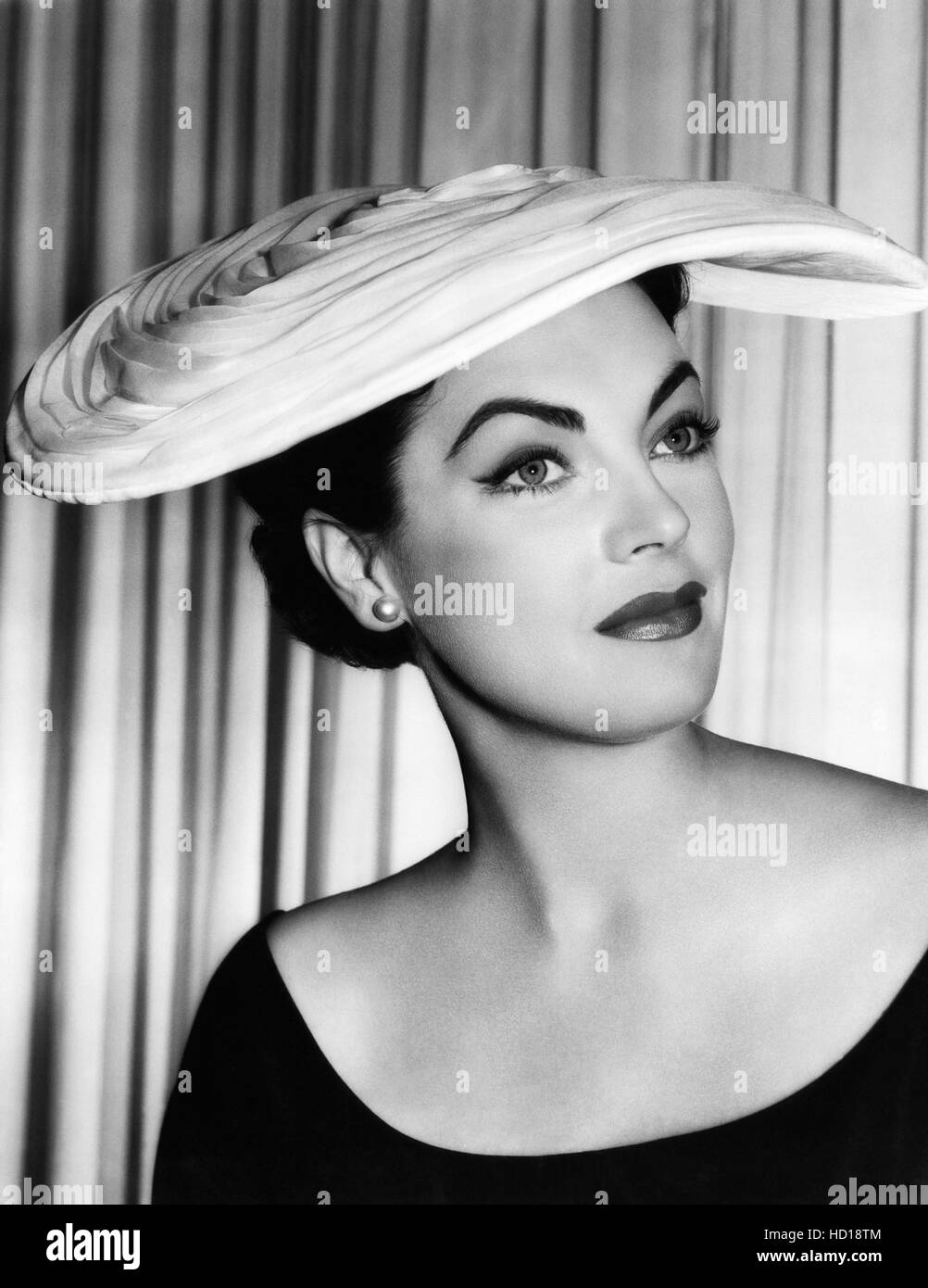 Jarma Lewis, modeling a silk organza dinner hat by Rex, 1955 Stock ...