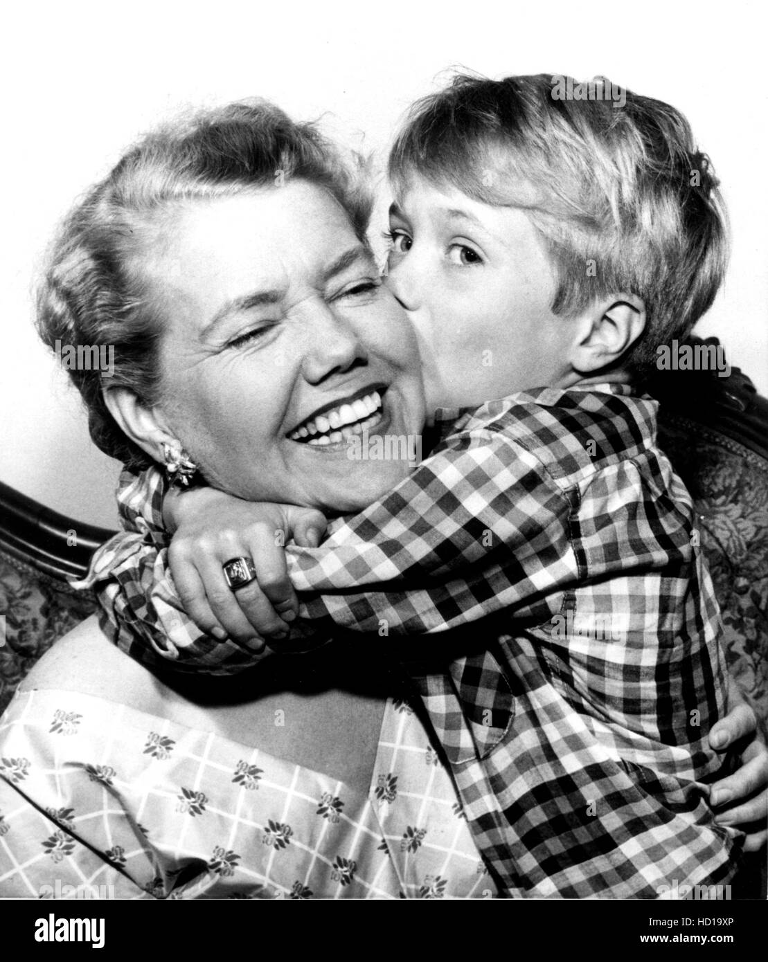 Jon Provost, kissing his mother, Cecile Provost, April 1958 Stock Photo ...