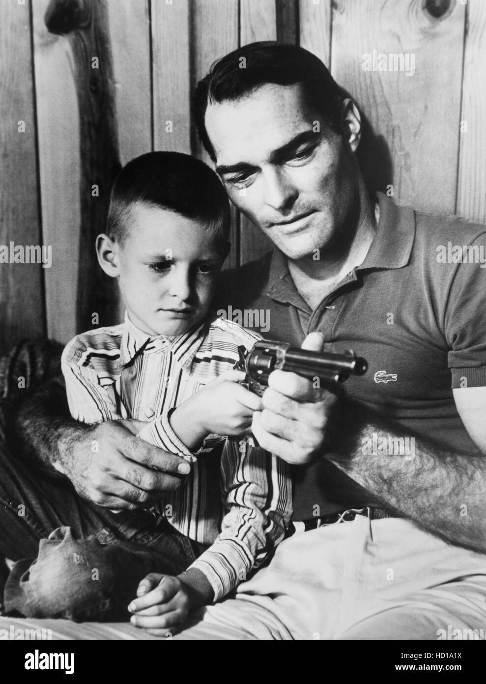 John Russell (right) teaching his son John James Russell some lessons ...