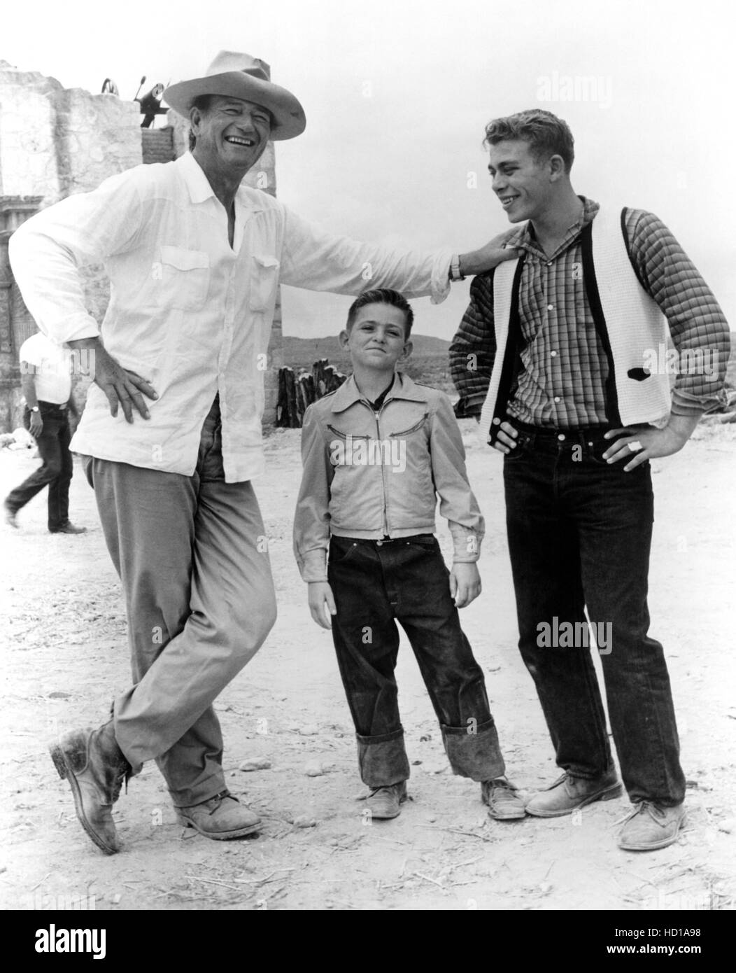 THE ALAMO, John Wayne poses with fans during break on set, 1960 Stock ...