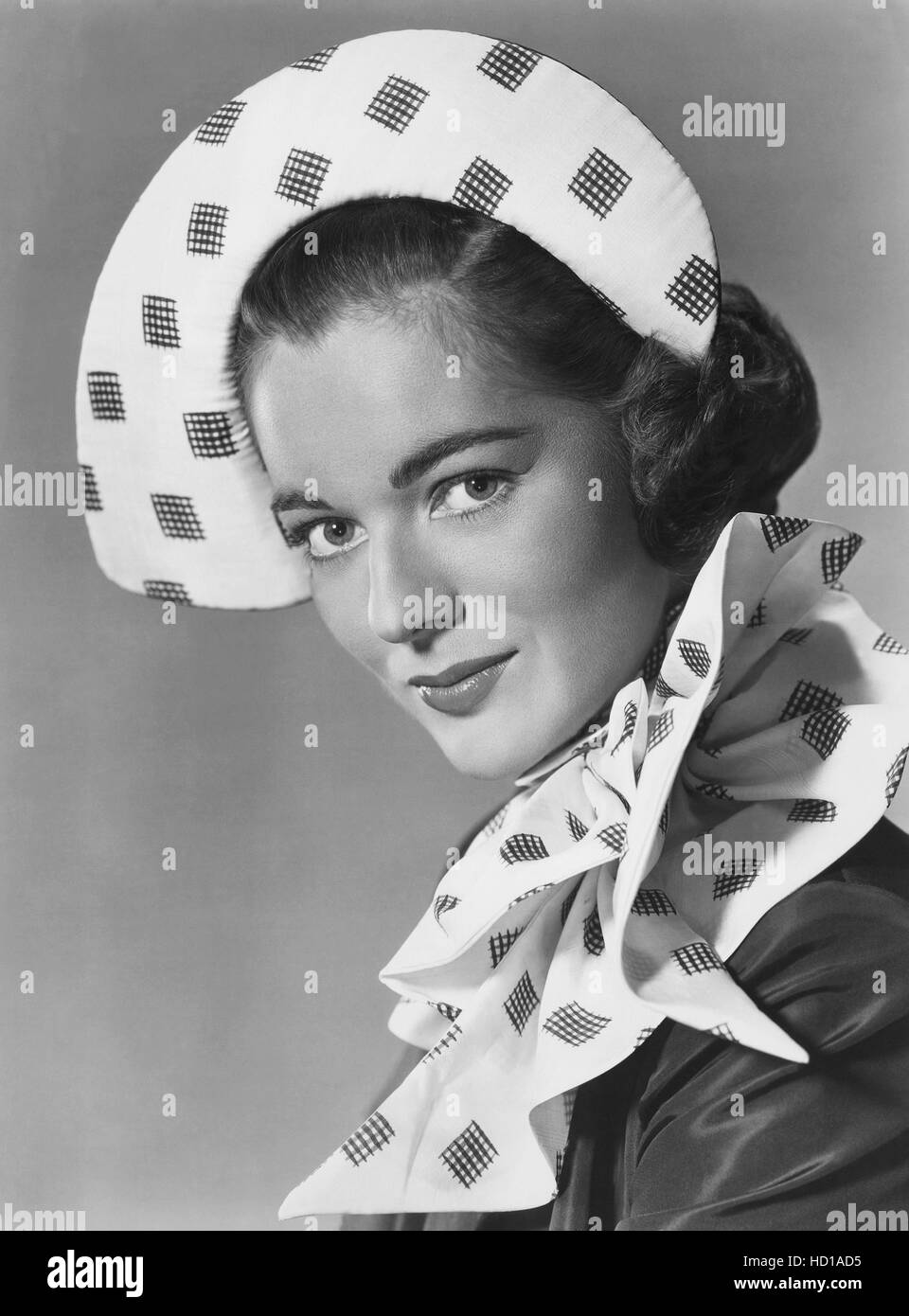Joan Weldon, wearing an off-the-face spring hat by Kenneth Hopkins ...