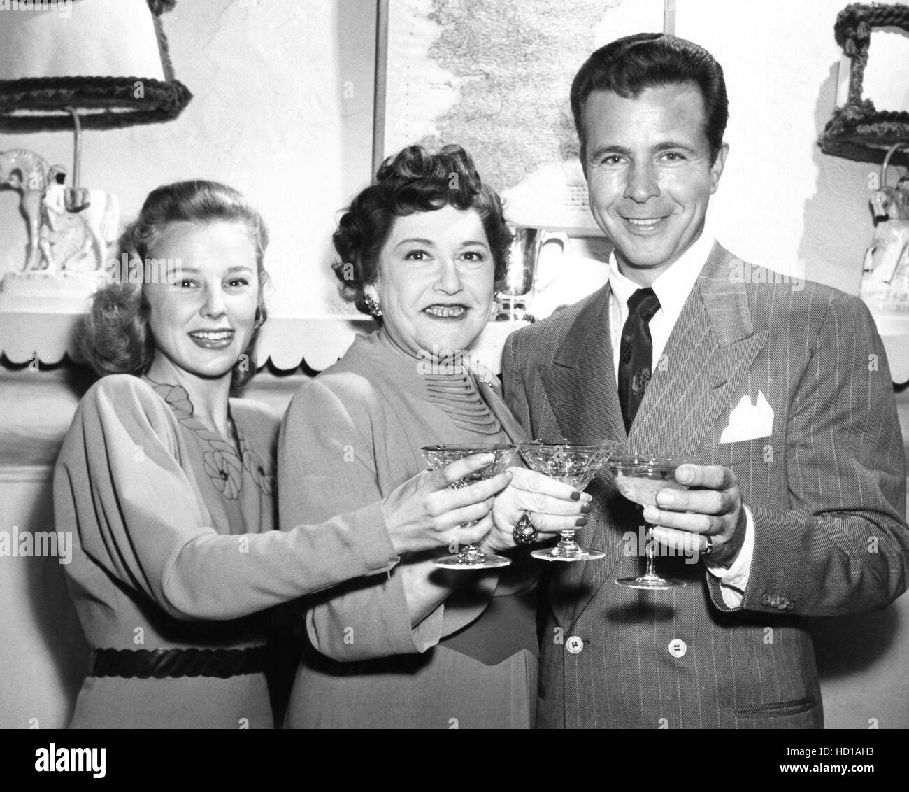 Left and right, spouses June Allyson, Dick Powell, with gossip ...