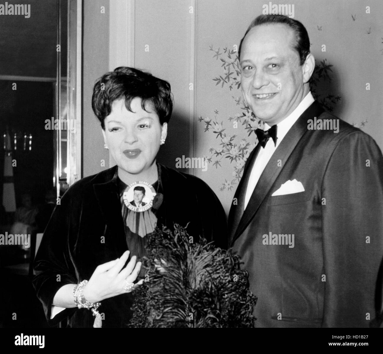 Judy Garland, (wearing a Kennedy campaign button), left, and her third ...