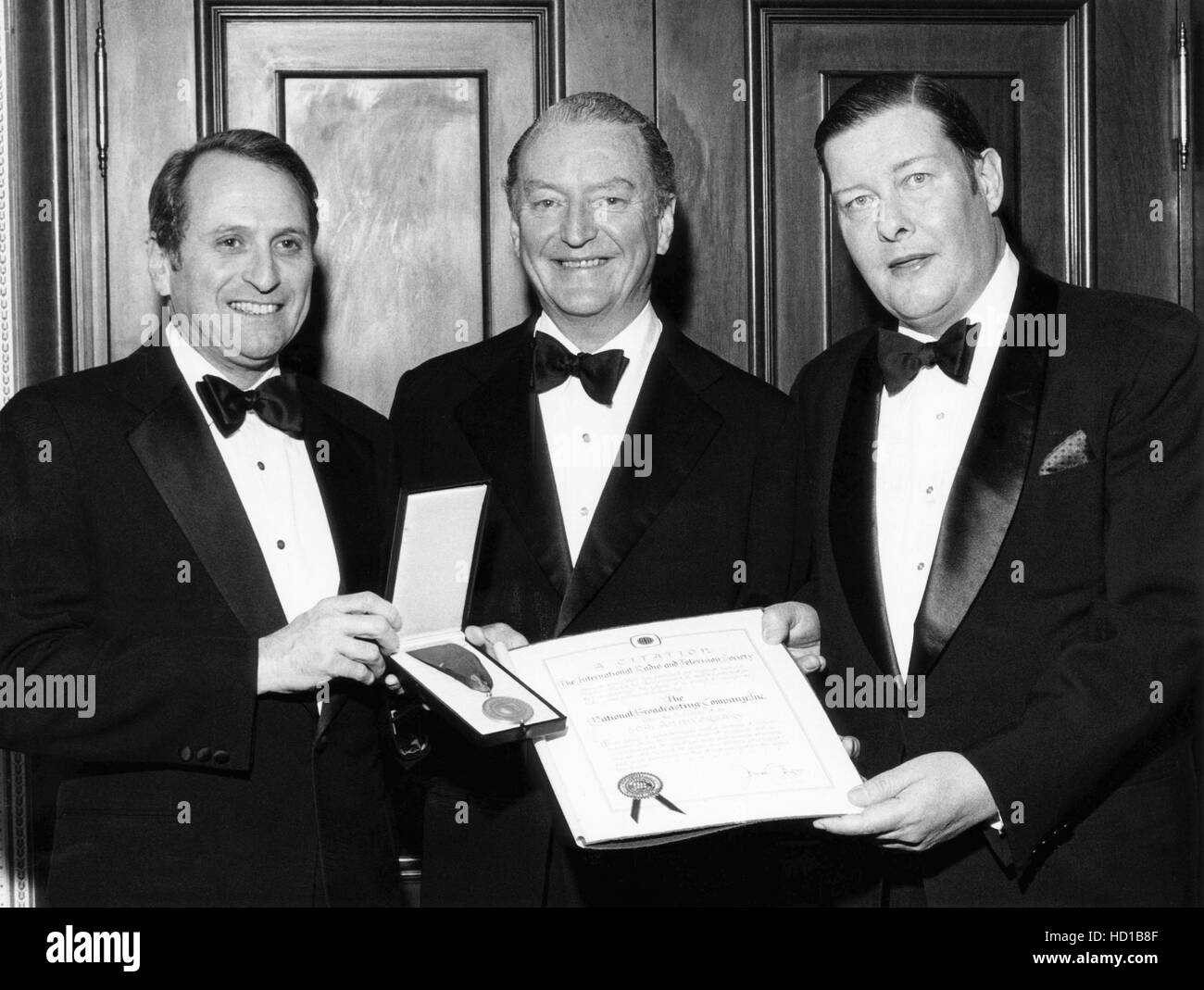 NBC chairman Julian Goodman (center) receives gold medal from ...