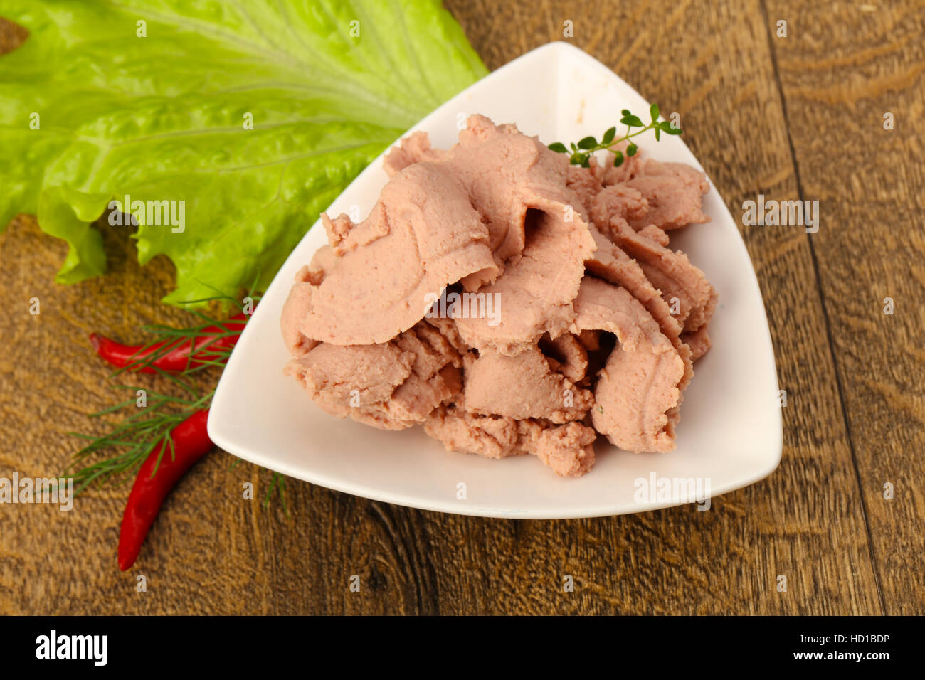 Liver pie in the bowl with salad leaves and thyme Stock Photo - Alamy
