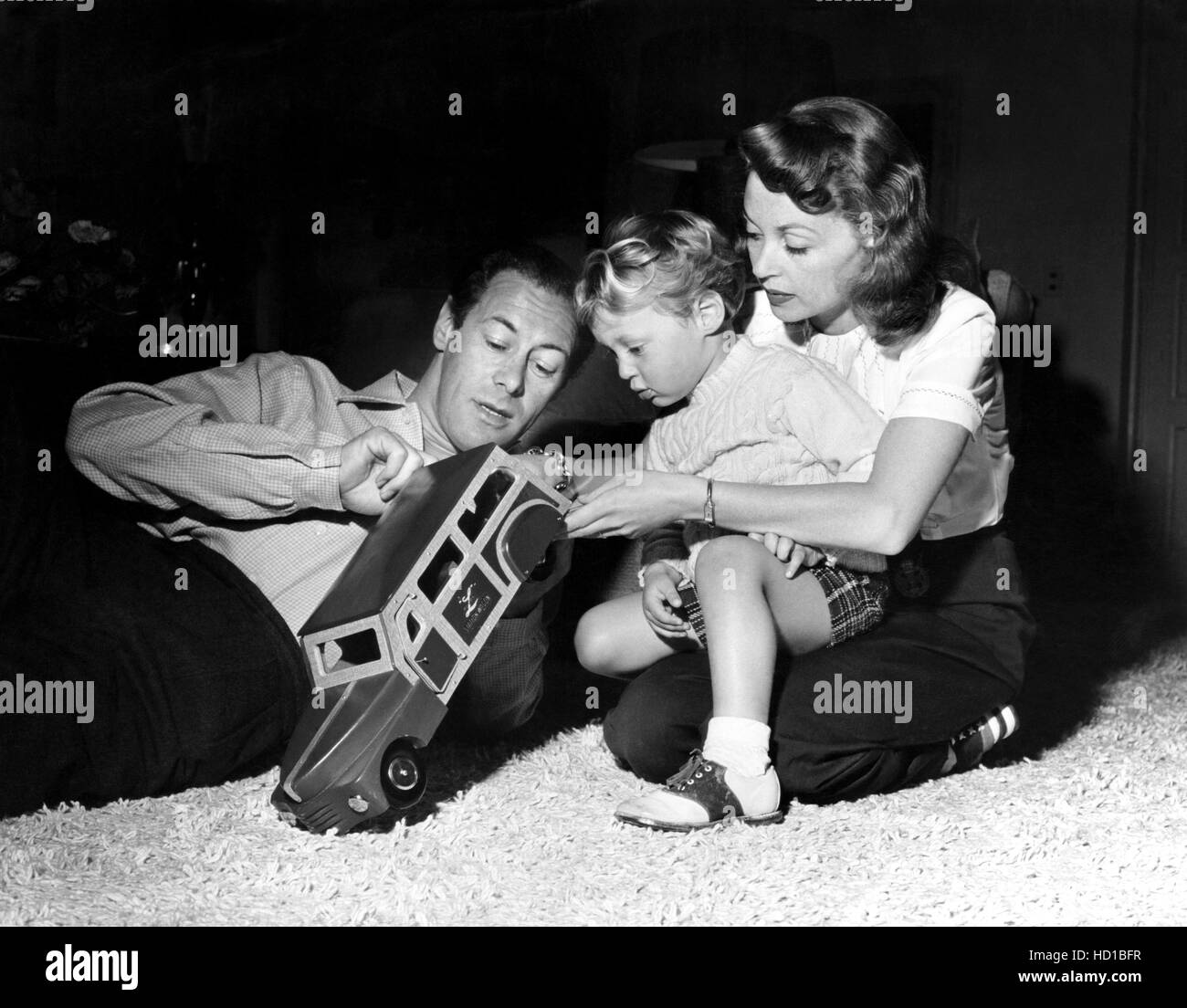 From left: Rex Harrison with son, Carey and wife, Lilli Palmer, ca ...