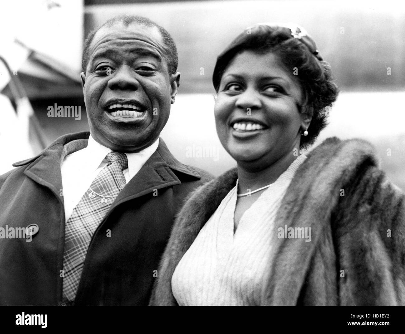 Louis Armstrong, Lucille Armstrong arriving at London airport for a ...