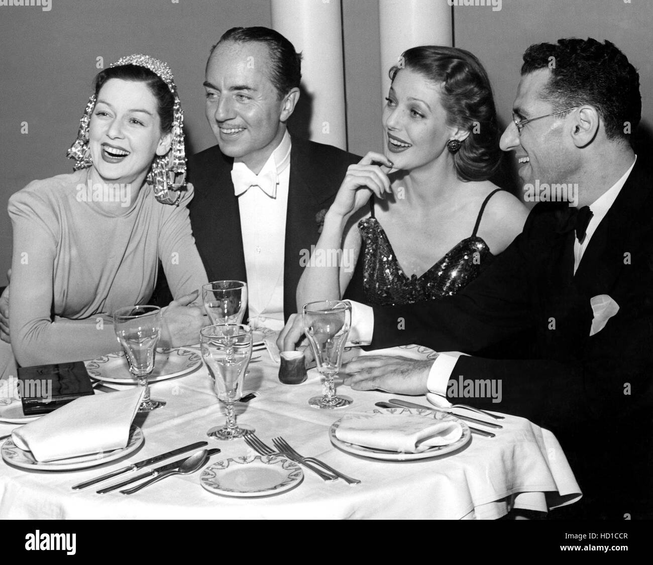 ROSALIND RUSSELL, WILLIAM POWELL, LORETTA YOUNG and GEORGE CUKOR dine ...