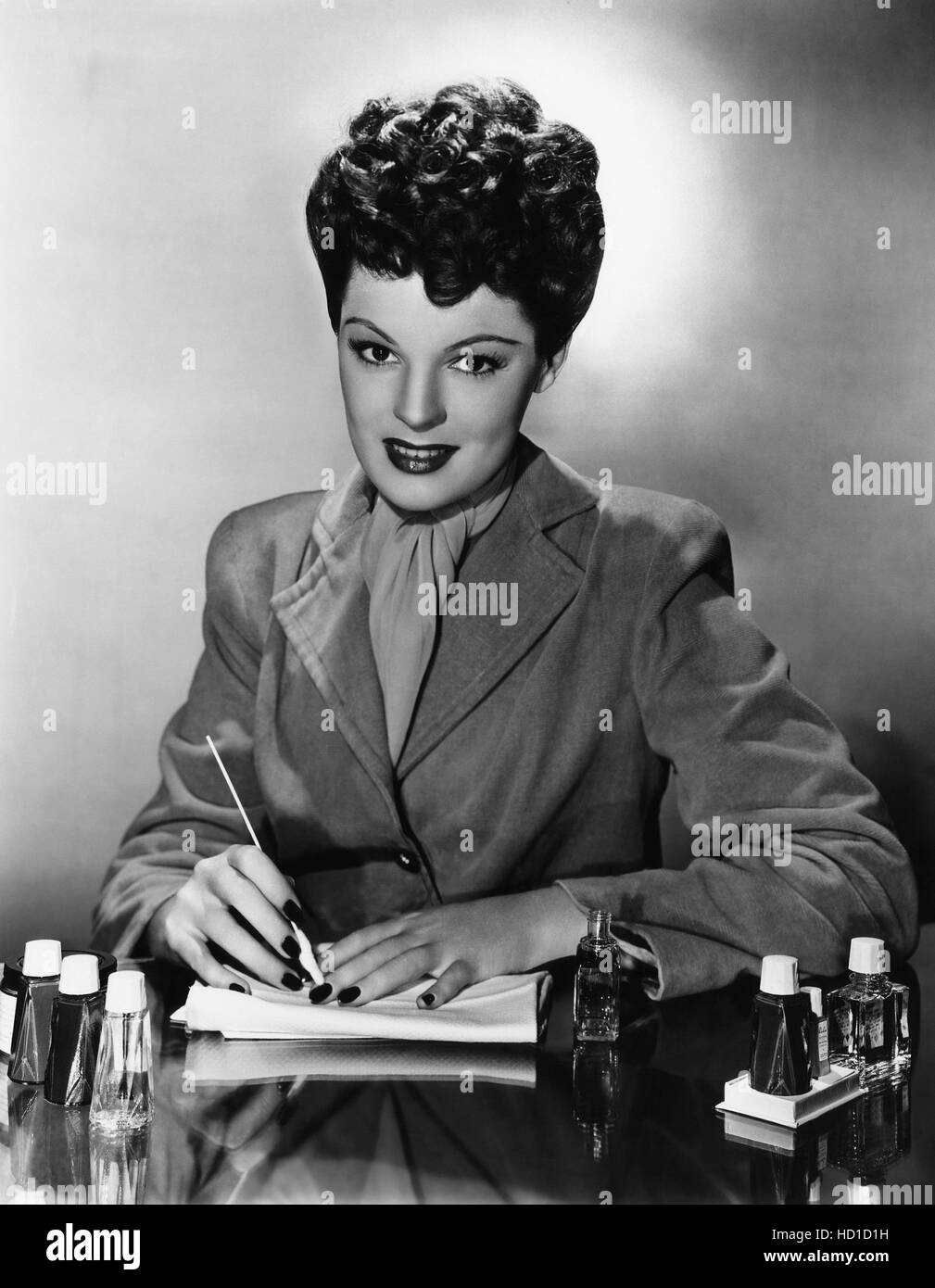 Lynn Baggett, giving herself a manicure, 1944 Stock Photo - Alamy