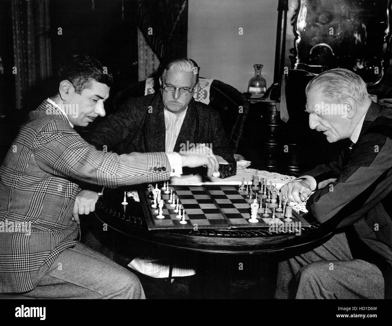 Prince Mike Romanoff relaxing over a game of chess with Frank Morgan ...