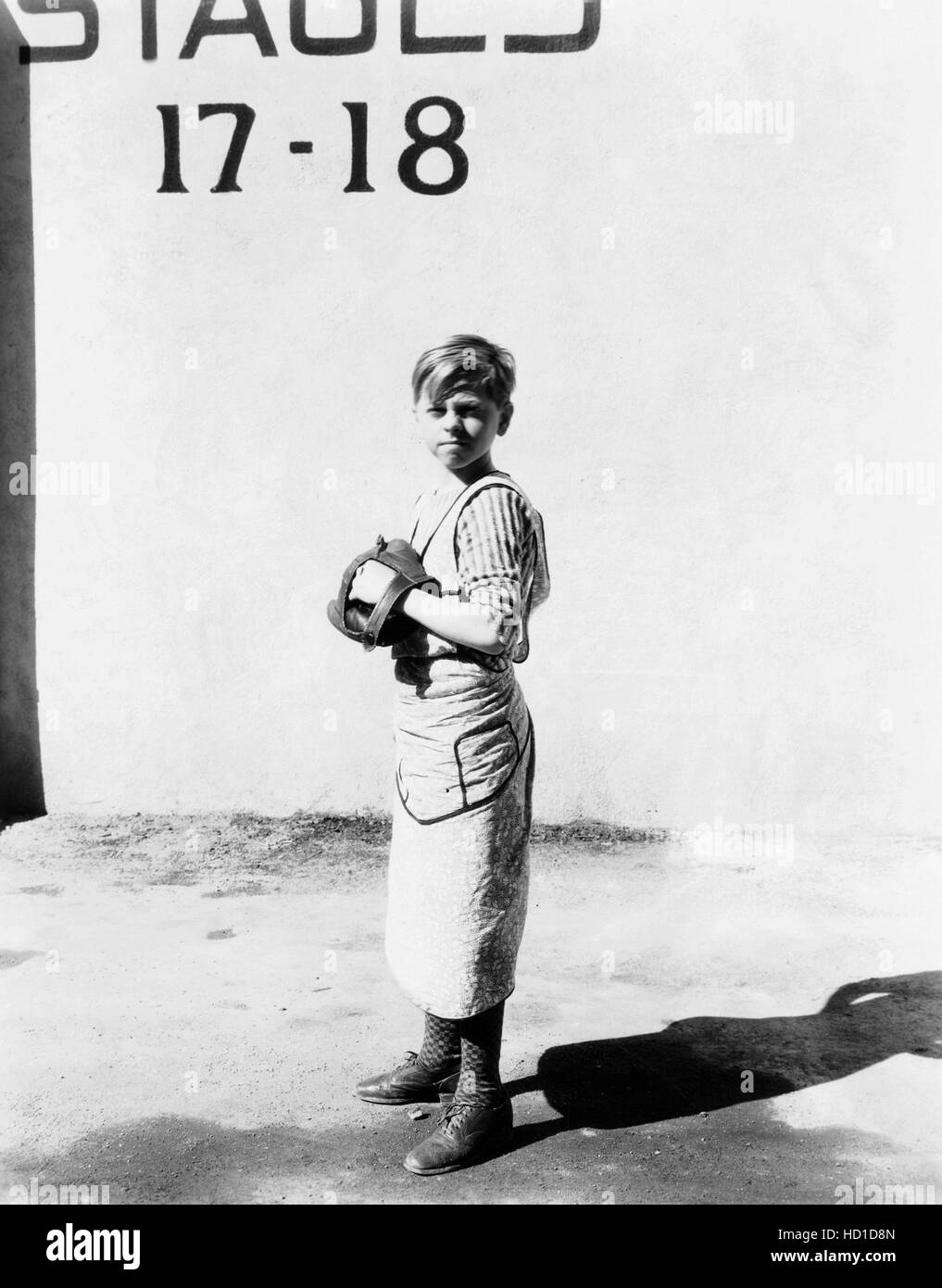 Mickey Rooney, playing softball on the Universal back lot, 1934 Stock ...
